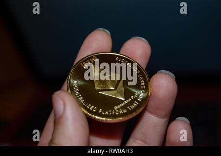 woman hand holding ethereum, close up phisical coin - ethereum ...