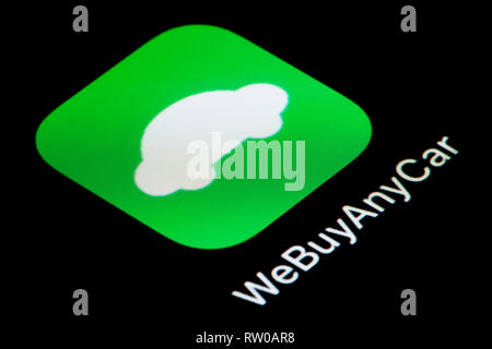 A close-up shot of the WeBuyAnyCar app icon, as seen on the screen of a ...