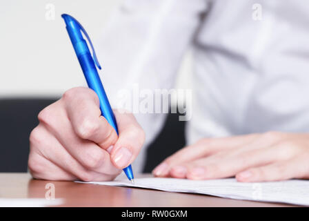 person's hand signing an important document Stock Photo - Alamy