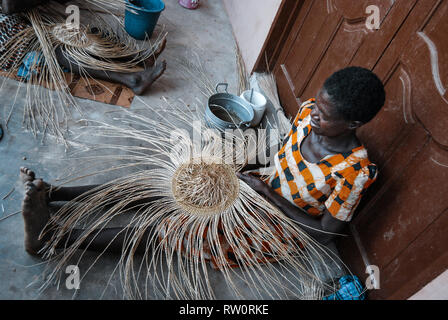 A photo of a local Ghanaian woman weaving the famous decorative and ...