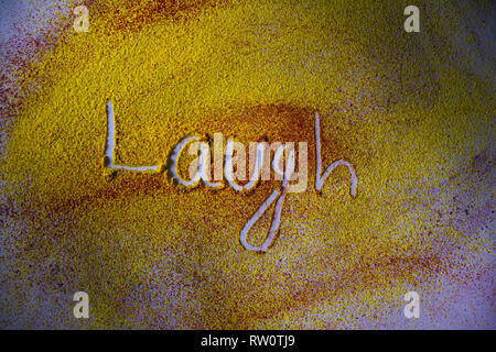 Colorful Powder written word Laugh Stock Photo - Alamy