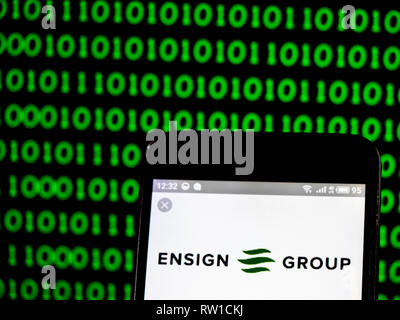 The Ensign Group, Inc. logo seen displayed on smart phone Stock Photo ...