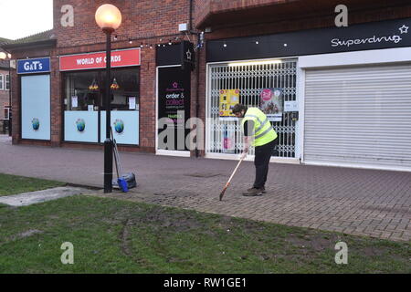 A man cleans the spot where former Russian spy Sergei Skirpal and his ...