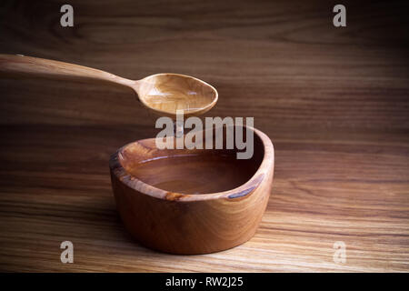 Fasting, Lent. Spoon and cup of water on wooden background Stock Photo ...