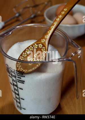 White Sugar in a Measuring Cup Stock Photo - Alamy