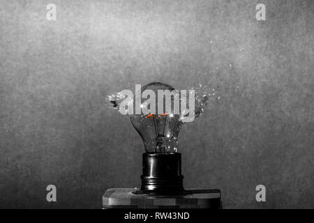 red light bulb exploding Stock Photo - Alamy