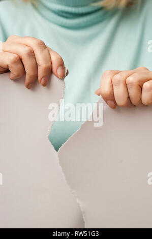 sequence images of the hands of a woman ripping a paper in half Stock ...