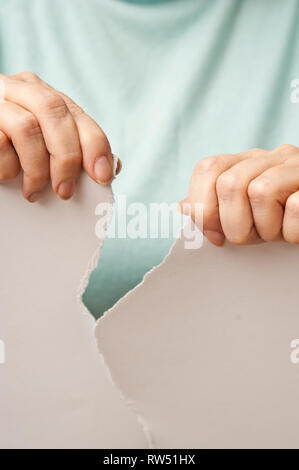sequence images of the hands of a woman ripping a paper in half Stock ...