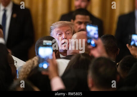 President Donald Trump greets people after arriving on the Freedom 250 ...