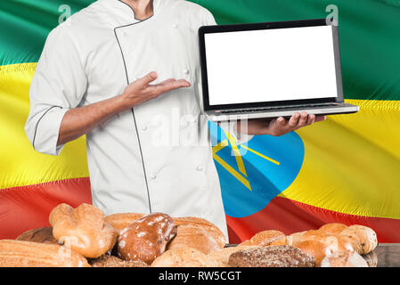 Ethiopian Chef holding blank whiteboard menu on Ethiopia flag ...