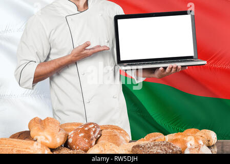 Malagasy Chef holding blank whiteboard menu on Madagascar flag ...