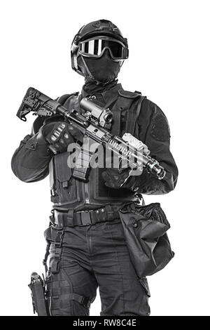 Studio shot of SWAT operator with assault rifle Stock Photo - Alamy