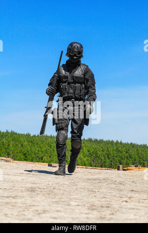 Shooting equipment in front of the target. Pistol, goggles and ...