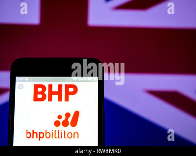 BHP Billiton mining company logo seen displayed on smart phone. This ...