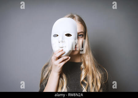 Take a look behind the mask Stock Photo - Alamy
