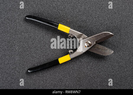 opened wire cutter on black backgrond Stock Photo - Alamy
