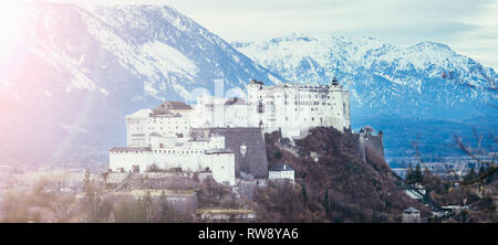 Fortress Hohensalzburg with snowy mountains in the background, autumn ...