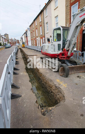 Digging up the pavement to replace gas pipe Stock Photo - Alamy