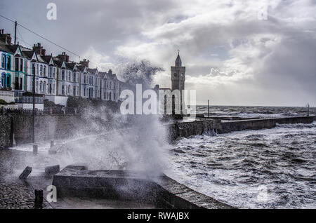 Porthleven clock tower with crashing storm waves,Huge waves generated ...