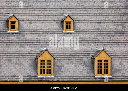A slate roof with Windows and dormers Stock Photo - Alamy