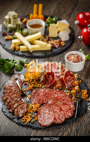 Food tray with delicious salami, pieces of sliced ham, sausage, Deli ...