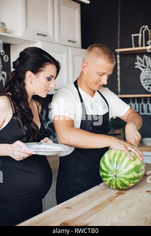 Beautiful young pregnant woman with fruits isolated on white Stock ...