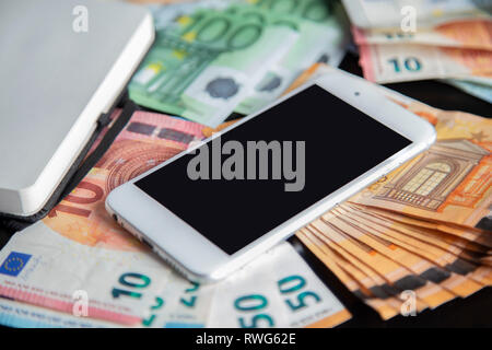 A lot of euro banknote on black background top view Stock Photo - Alamy
