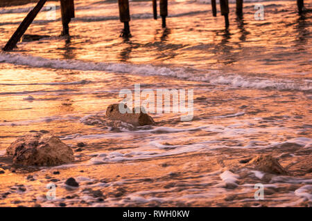 rocks on the water at Atlit beach,sunset time, Israel Stock Photo - Alamy