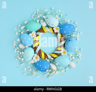 Easter wreath with colorful speckled eggs artificial red flower red ...