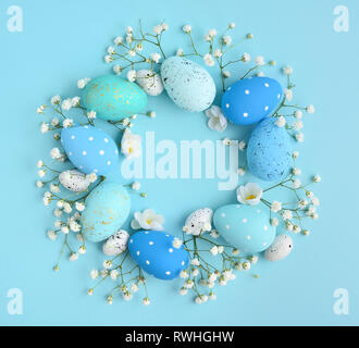 Easter wreath with colorful speckled eggs artificial red flower red ...