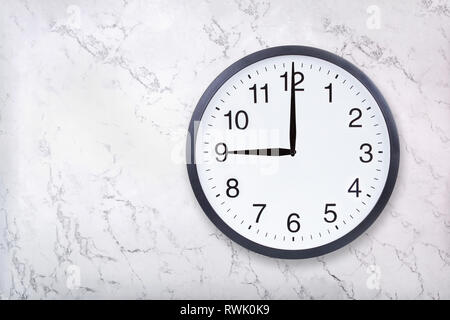 analog wall clock showing nine o'clock Stock Photo - Alamy