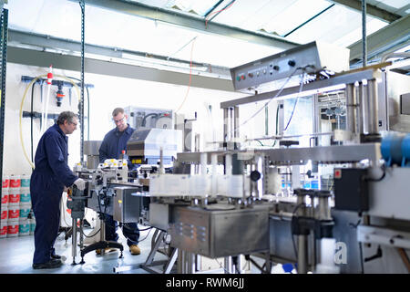 two chemical factory workers working in plant Stock Photo: 57830349 - Alamy