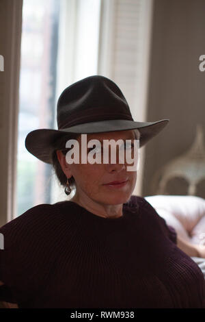 Portrait of stylish mature woman on color background Stock Photo - Alamy