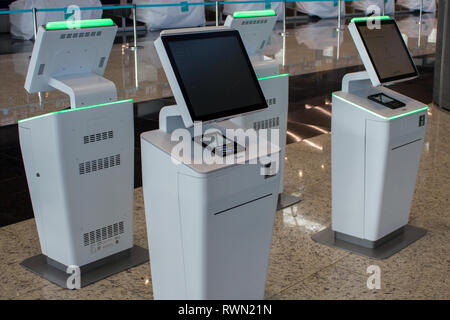 Airport self check-in kiosk ticket machine Stock Photo - Alamy