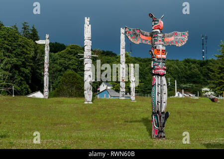 Totem poles in cemetary, Alert Bay, Cormorant Island, British Columbia ...