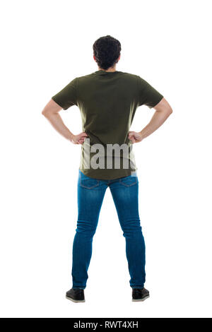 Full length backside view of a male doctor with hands behind his back ...