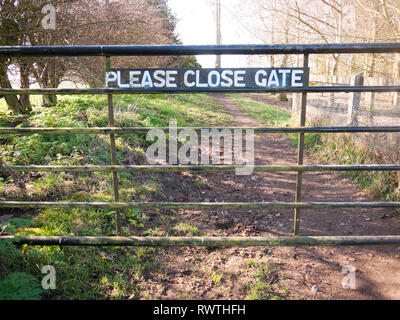 open gate with please close the gate sign open countryside Stock Photo ...