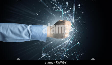 Big hand hits intense and breaks glasses Stock Photo - Alamy
