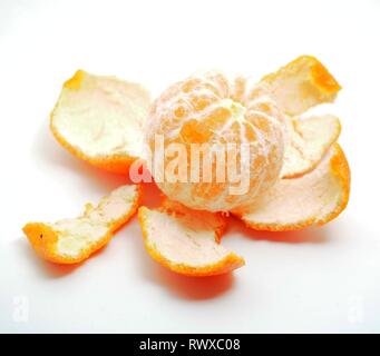 Mandarin is cleared from the skin. Fruit on white background. Still ...