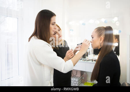 makeup teacher with her student girl. Makeup tutorial course at beauty ...
