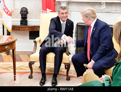 President Donald Trump, right, shakes the hand of Nassau County ...