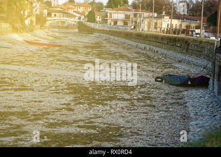 River drought, blue boat without water due global warming and measuring ...