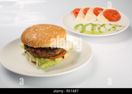 Dried slices of tasty mushrooms with peppers and parsley on black stone ...