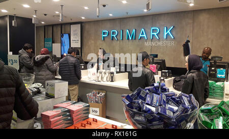 Customers queue up for the tills (checkouts) at Primark in Manchester ...