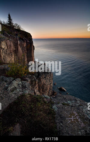 Palisade Head, the Lake Superior shore are seen just before sunset ...
