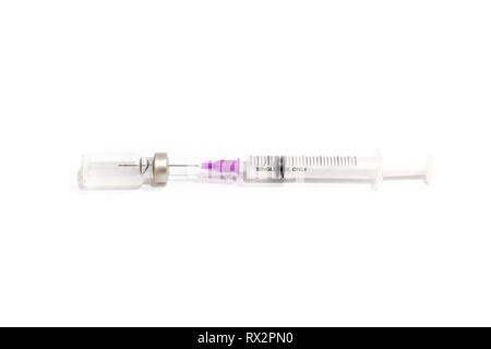 Vials with medication and injection needle isolated on white background ...