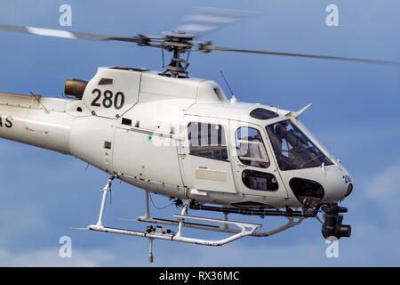 Eurocopter AS-350BA Helicopter conducting aerial filming with a nose ...