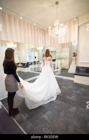 happy bride tries on a wedding dress Stock Photo - Alamy