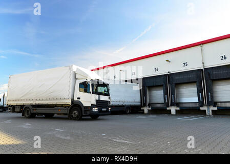 Loading Lorry Trailer at Warehouse Dock Stock Photo - Alamy