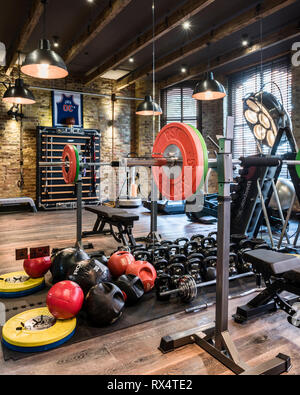 Exercise equipment in rustic gym Stock Photo - Alamy